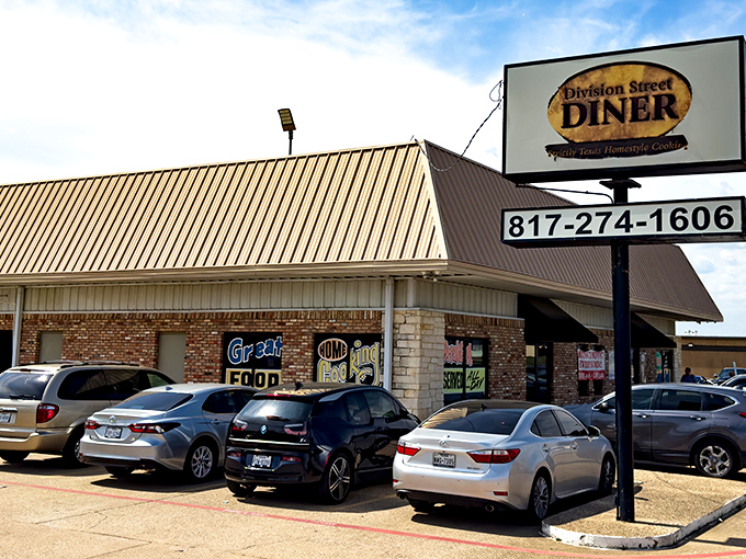 Division Street Diner's sign stands tall above the parking lot, a landmark for Arlington breakfast enthusiasts.