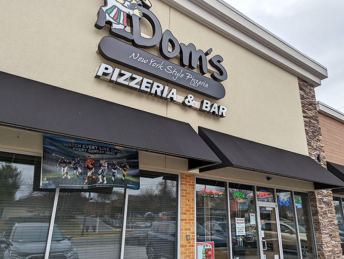 Dom's sleek exterior promises New York pizza attitude in Delaware. That TV isn't the main attraction&mdash;what comes out of those ovens is.
