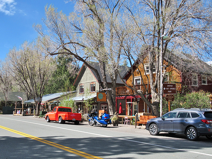 Markleeville's rustic buildings nestle among pine trees, offering a glimpse of authentic Sierra mountain living.