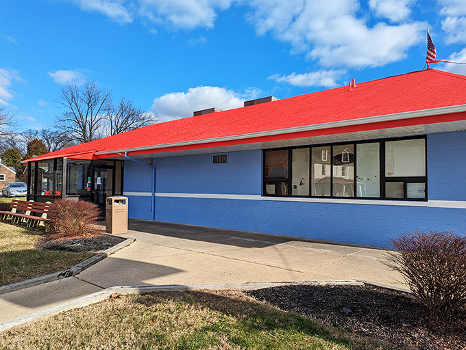 Bold blue walls and a cherry-red roof—this diner dresses like it knows exactly how good its pancakes are.