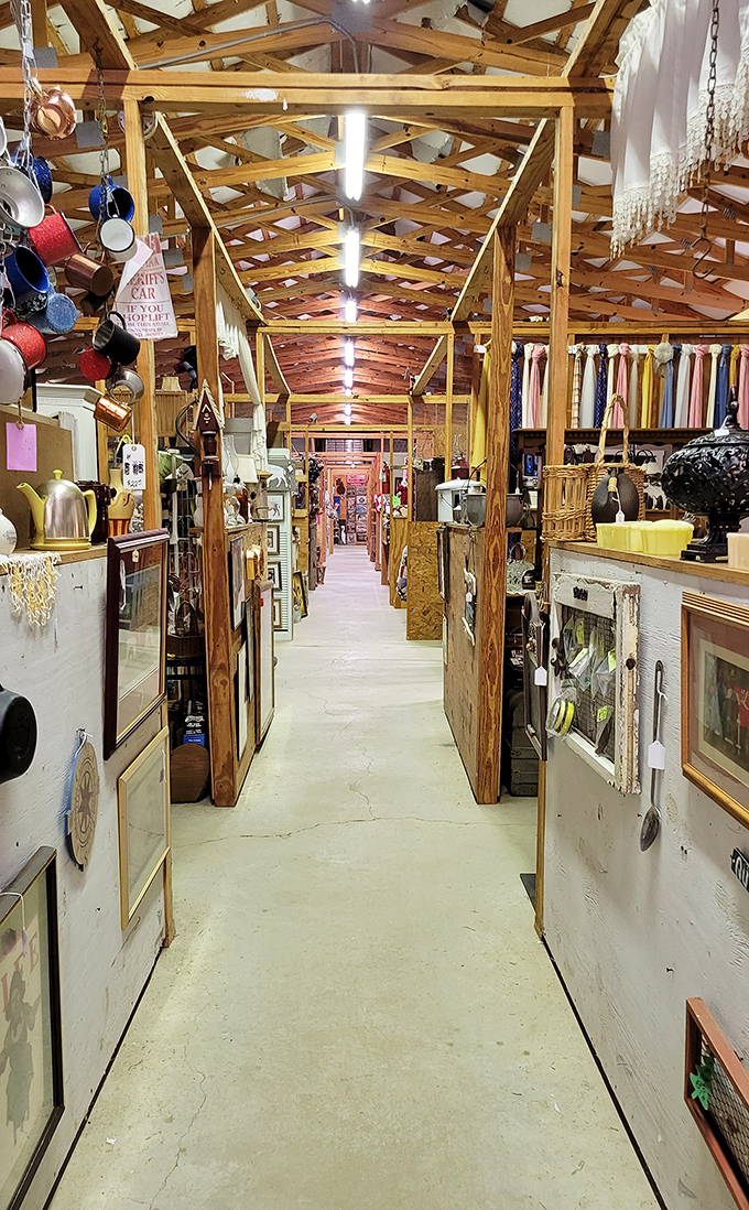 Nuziebell's Flea Market's wooden interior creates a rustic shopping experience. These narrow aisles lead to discoveries that big box stores could never offer!