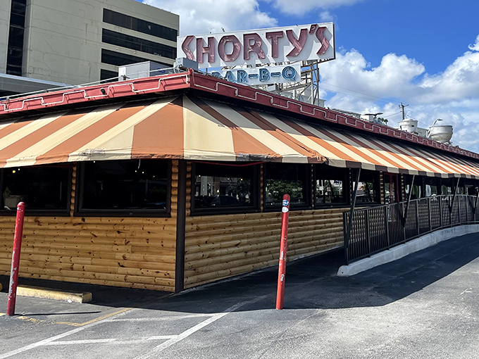 That iconic striped awning has welcomed generations of barbecue lovers seeking Miami's most legendary smoked meats.