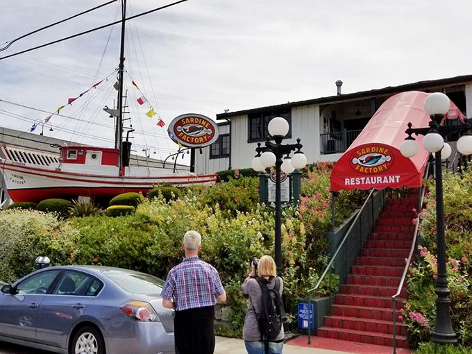 The nautical theme and fishing boat out front aren't just decoration - they're promises of the fresh catches awaiting inside.