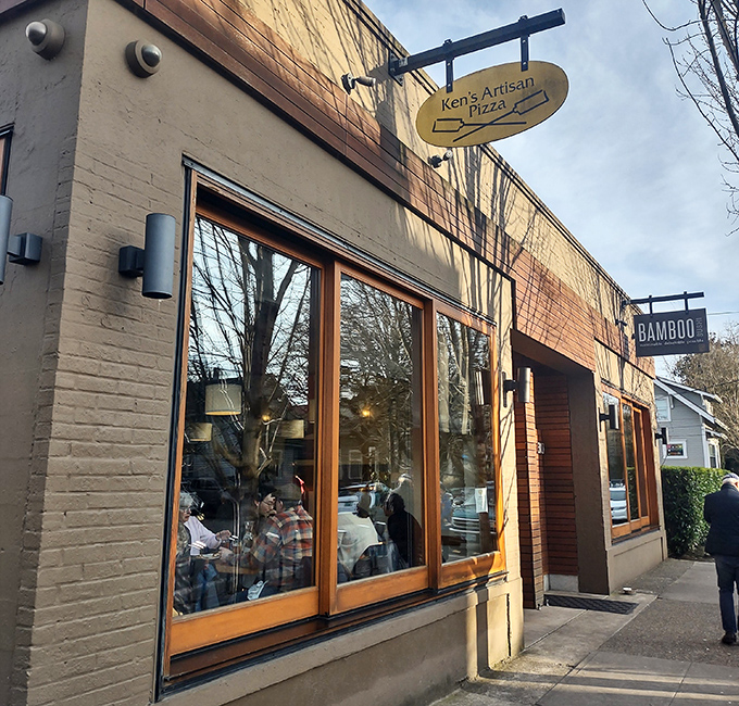 Those big windows reveal pizza theater in action, where dough becomes art and hunger becomes pure joy.