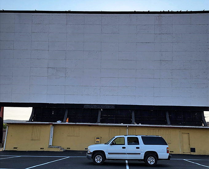 Central Coast movie magic! Sunset Drive-In's massive screen stands ready against SLO's perfect evening sky.