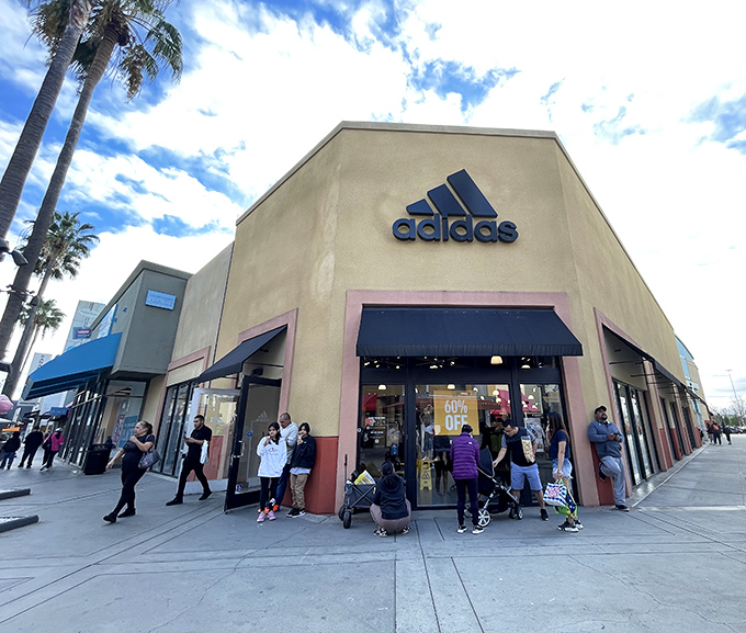 The Adidas store corner draws athletic enthusiasts and athleisure devotees alike, proving that looking sporty is sometimes more important than actually being sporty.
