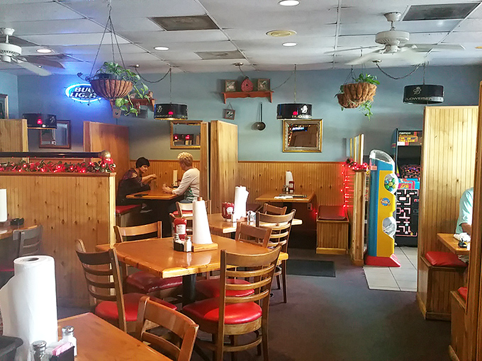 Cozy booths and hanging plants create that "grandma's house meets your favorite bar" vibe that makes you want to settle in for the afternoon.