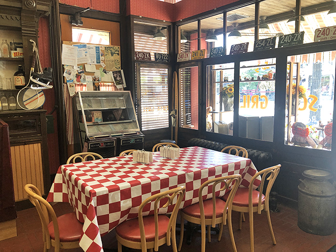Red and white checkered tablecloths aren't just decoration—they're a promise that whatever lands on them will taste like childhood summers.