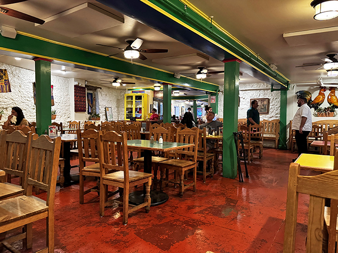 Green support beams frame the dining experience like a living postcard – "Wish you were here eating enchiladas with me!"