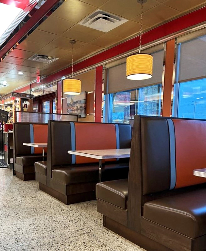 Booths designed for comfort and conversations that matter. The red and blue color scheme says "America" while the cushions whisper "stay awhile."