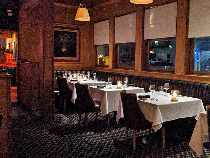 White tablecloths and warm wood paneling create the kind of dining room where deals are made and anniversaries celebrated.