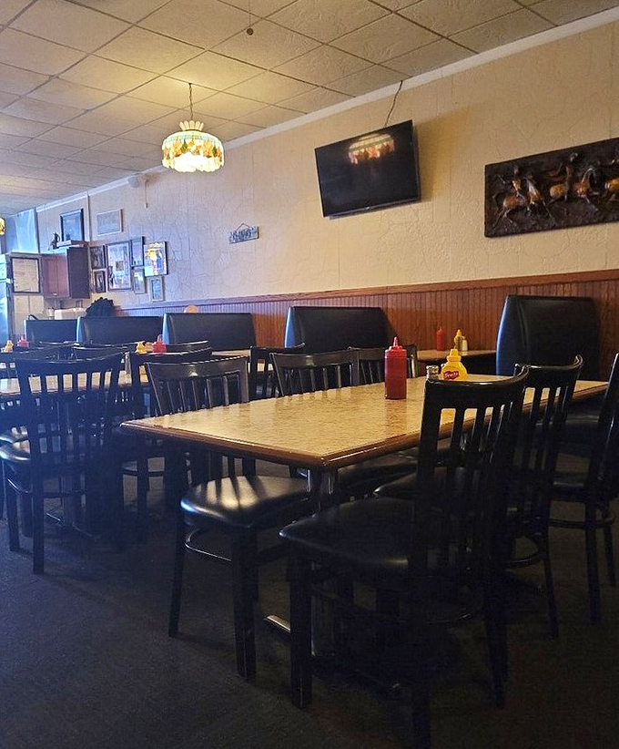 The dining area feels like your favorite uncle's den – comfortable, unpretentious, and ready for conversations that could last hours. Those booths have heard some stories.