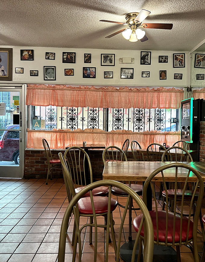 Peach curtains and family photos create that "grandma's house" vibe&mdash;if your grandma happened to make the best Mexican food this side of the border.