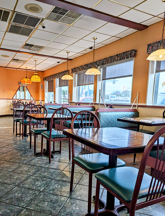 Morning light streams through windows, illuminating empty tables that won't stay that way for long. The calm before the breakfast storm.