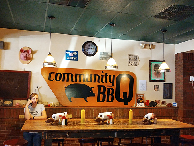 The interior wall proudly displays the Community Q logo &ndash; a simple pig silhouette that promises straightforward barbecue excellence without unnecessary frills.