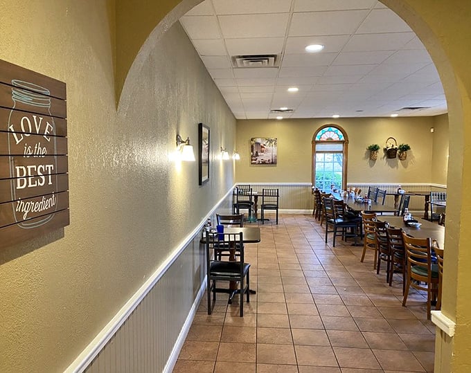Archways frame this dining space where "Love is the best ingredient" isn't just wall art&mdash;it's the restaurant's operating philosophy.