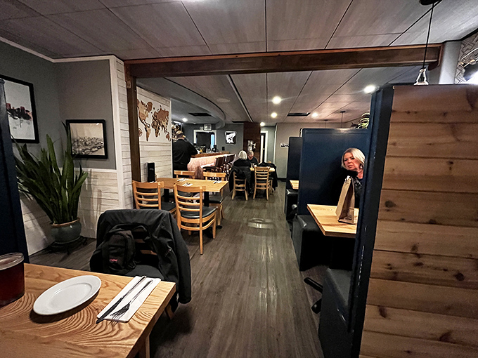 The dining room's warm wood and soft lighting create that rare atmosphere where both first dates and anniversary dinners feel equally at home.