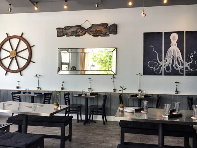 Octopus art watches over diners like a guardian of good taste. The minimalist tables let the food take center stage. 