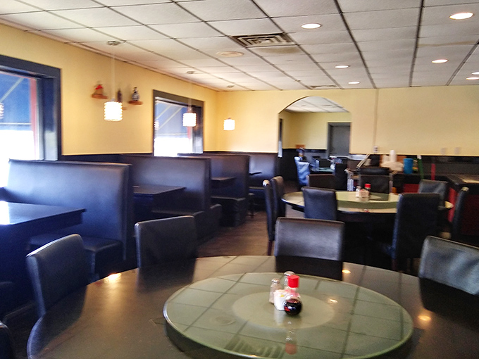 Comfortable booths line the walls, creating cozy nooks for the serious business of enjoying multiple plates without rushing or apology.