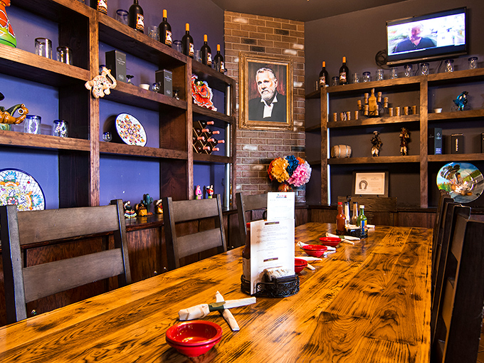 The private dining area offers rustic elegance with a touch of tequila sophistication. Those wooden shelves aren't just storage&mdash;they're a liquid library of agave excellence.