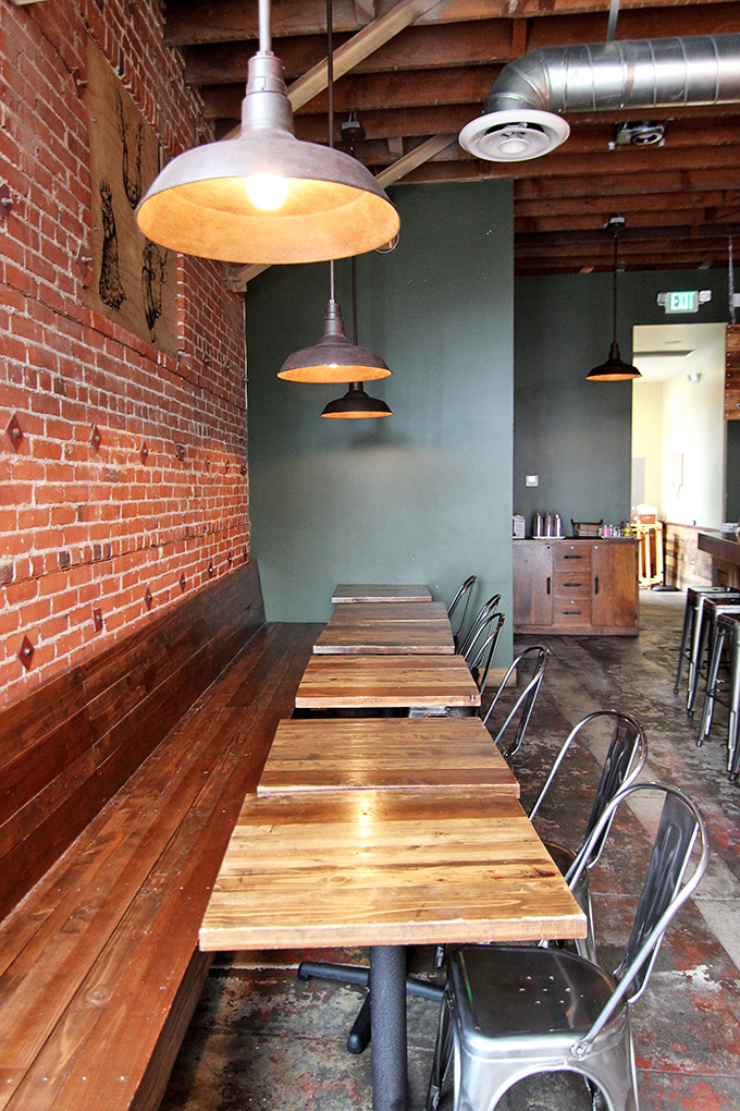 Simple wooden tables against brick walls &ndash; because when the food is this good, you don't need fancy surroundings to distract you.