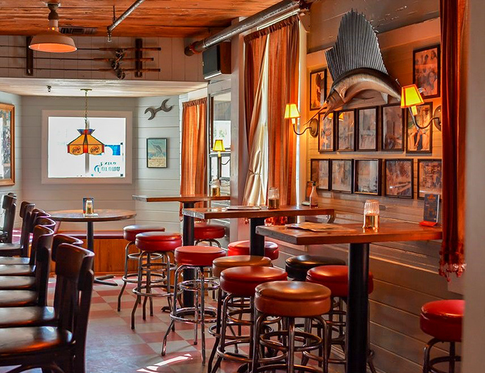 Warm wood, orange curtains, and mounted fish – the Florida restaurant trifecta that signals you're about to eat something that was swimming this morning.