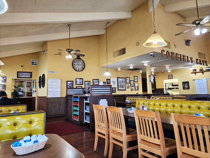 Ceiling fans lazily spin above diners lost in breakfast bliss. The wood-paneled walls and yellow booths create a timeless diner aesthetic that never goes out of style.