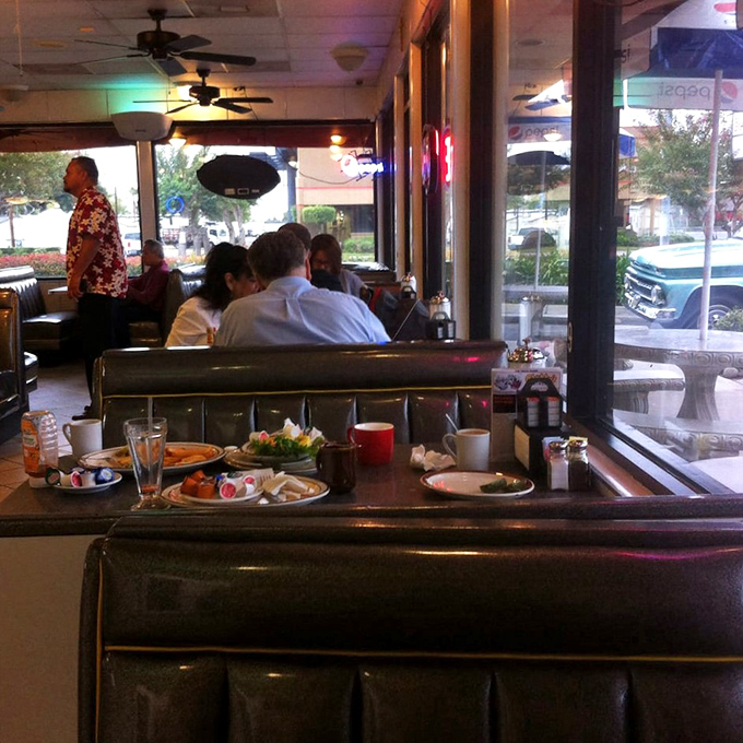 Booths designed for lingering conversations and that second cup of coffee, where breakfast at 3 PM is not just allowed but encouraged.