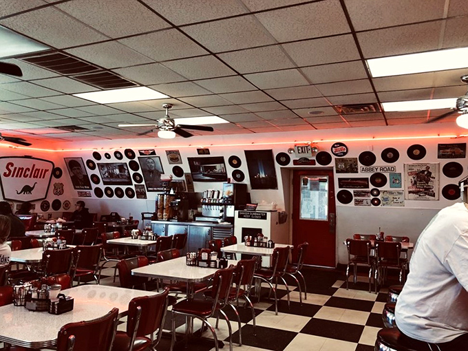 Vintage records, classic car memorabilia, and that checkerboard floor create the perfect backdrop for comfort food that hasn't changed because it doesn't need to.