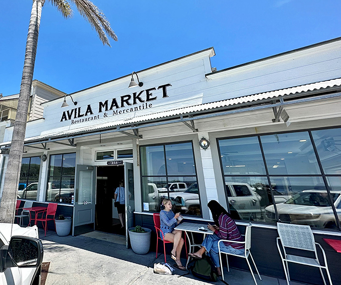 Avila Market's clean lines and outdoor seating create that perfect spot where coffee and conversation flow as easily as the nearby tide.