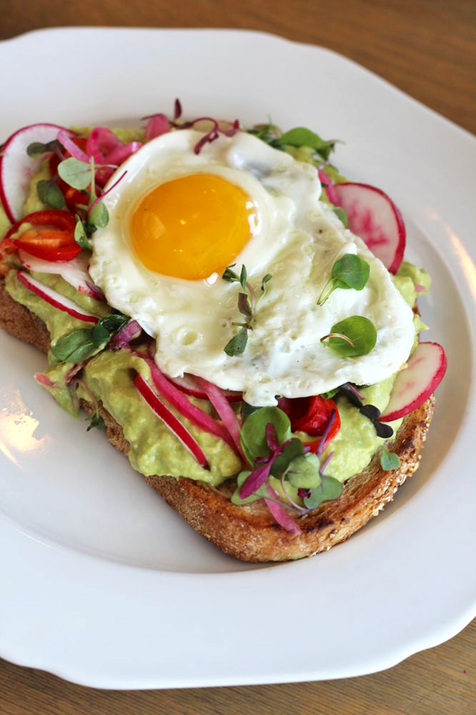 Avocado toast elevated to an art form. Those radishes and that sunny egg transform a trend into a tradition.