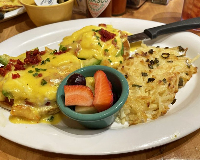 The Avocado Tomato Benedict performs a delicate balancing act &ndash; rich hollandaise and creamy avocado finding perfect harmony with bright, acidic tomatoes.