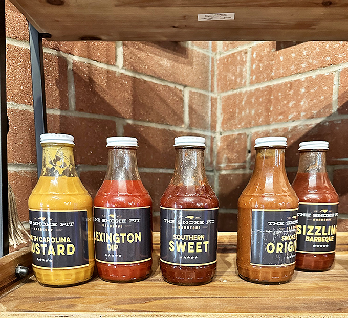 House-made sauces lined up like liquid gold, each bottle containing the secret to barbecue happiness.