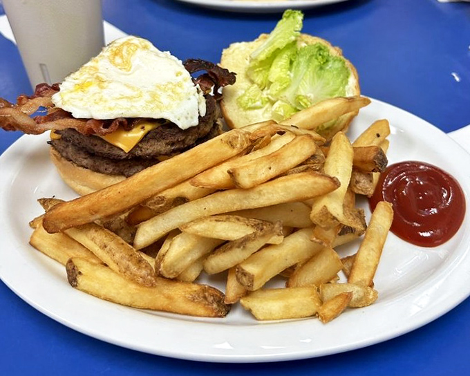 The burger that answers the eternal question: "Why choose between breakfast and lunch?" That fried egg on top is living its best life.