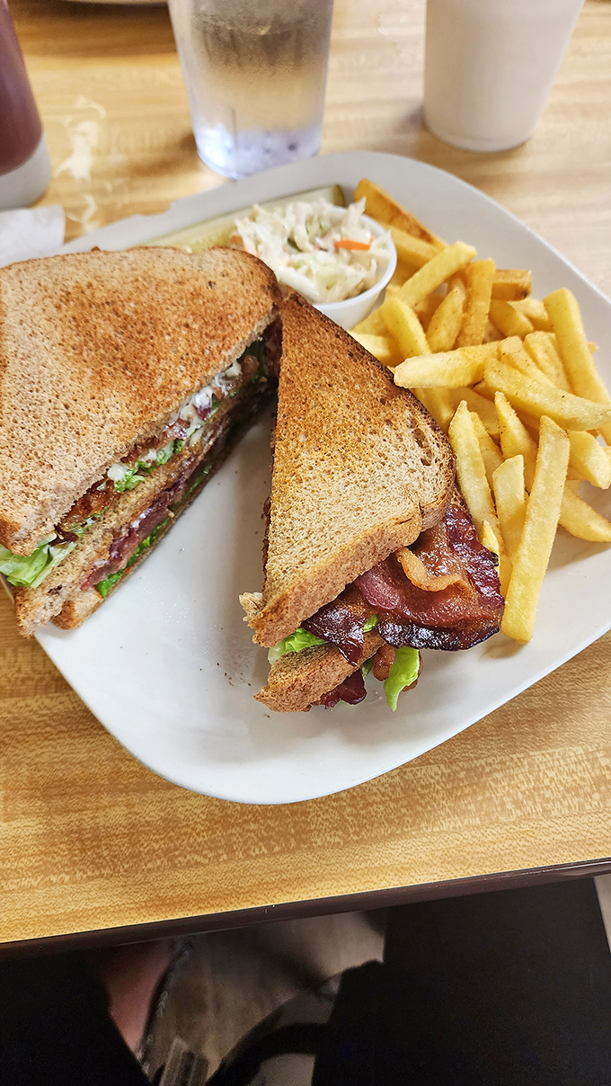 The humble BLT elevated to art form. Between those perfectly toasted slices lies the perfect balance of savory, crispy, and fresh.