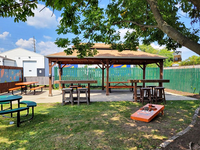The backyard picnic area offers a slice of summer perfection&mdash;where cornhole games and picnic tables invite you to linger just a little longer.