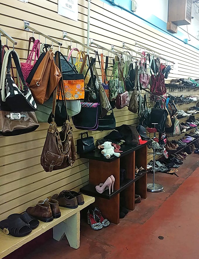 Handbags dangle like exotic fruit from wall hooks, while shoes below patiently wait for Cinderella moments at a fraction of department store prices.