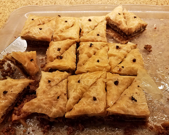 Flaky, honey-soaked baklava squares that shatter delicately with each bite. The perfect sweet finale to a seafood marathon.