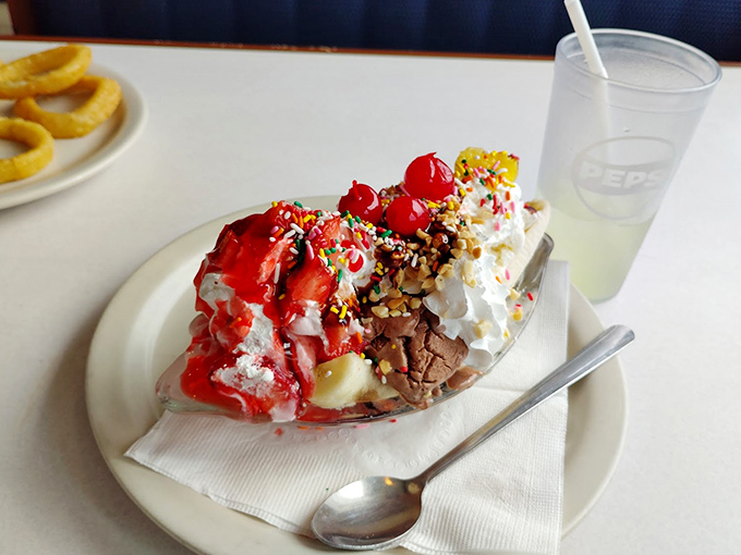 A banana split that's not just dessert, but a childhood memory served in a boat with extra sprinkles.