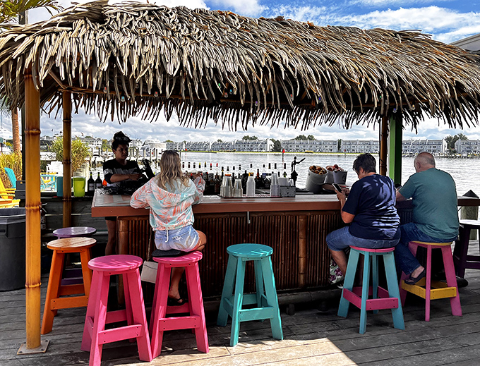 A tiki-inspired dock bar with colorful stools&mdash;because seafood tastes better when your feet could theoretically touch the water it came from.