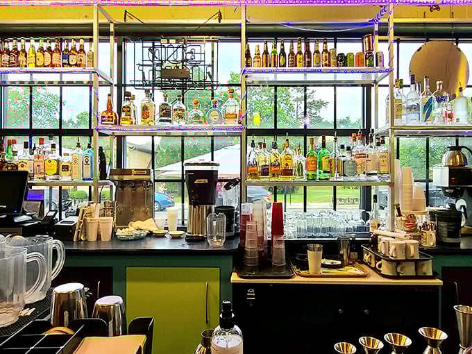 The bar that promises liquid sunshine &ndash; a colorful array of bottles standing at attention, ready to transform your ordinary Tuesday into something special.