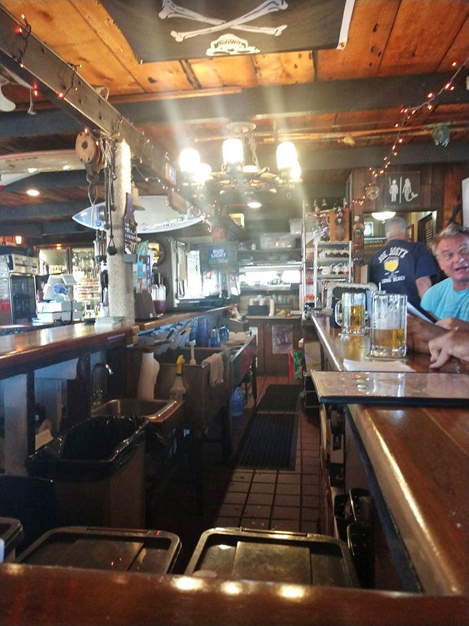 The bar area feels like the captain's quarters of a well-loved vessel&mdash;compact, efficient, and ready to pour something cold after a day at sea.