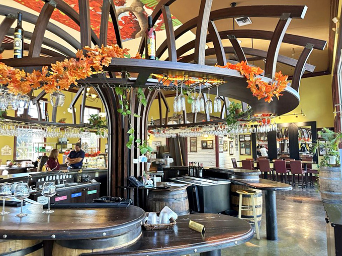 The circular wine bar isn't just functional&mdash;it's a stage where glasses dangle like crystal performers waiting for their moment to shine.