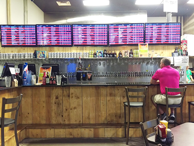 Beer enthusiasts, meet your new happy place. That electronic board isn't the departures list at an airport—it's your roadmap to hoppy happiness.