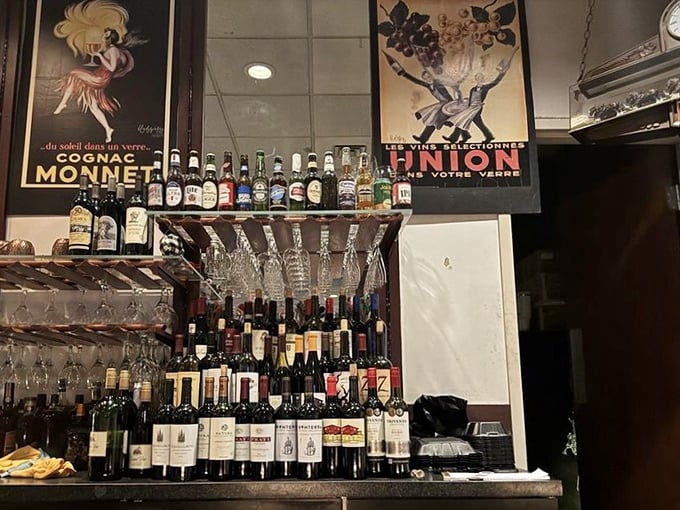 A well-stocked bar featuring vintage French posters and an impressive wine selection for every palate and occasion.