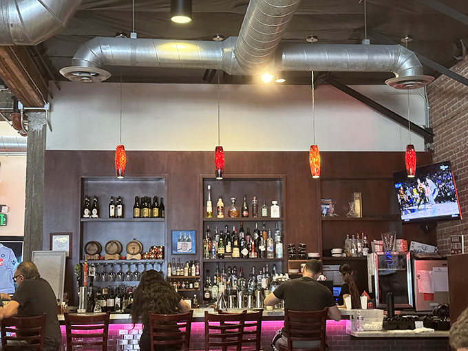 The bar isn't just serving drinks&mdash;it's facilitating pizza appreciation ceremonies. Wine and beer: pizza's favorite dance partners.