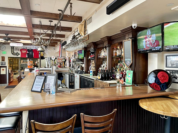 The bar area: where strangers become friends and friends become regulars, all under the warm glow of well-stocked shelves.