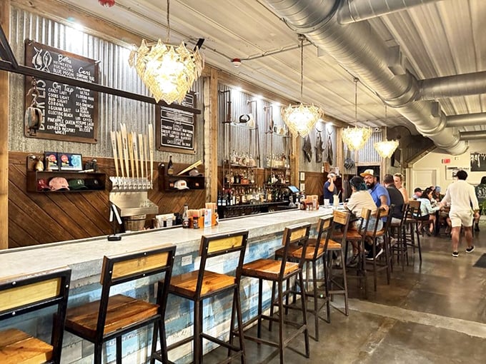 The bar at The Docks: where nautical industrial meets island casual, and every stool offers a front-row seat to mixology magic.