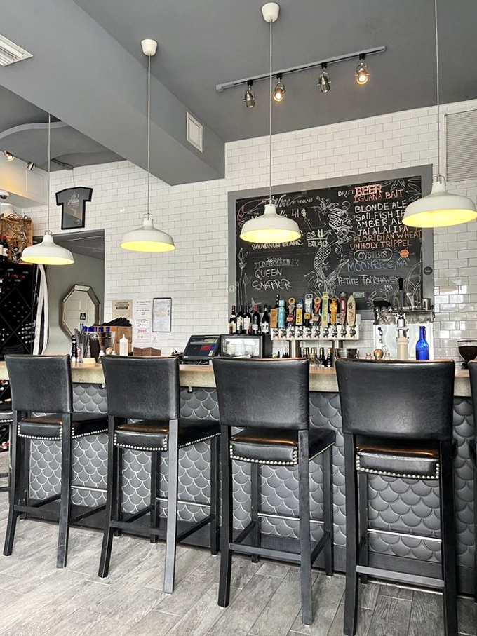 A bar that says "pull up a seat and stay awhile." The mermaid-scale detail is the Instagram moment you didn't know you needed.