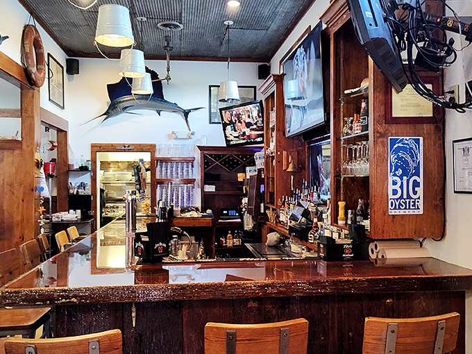 The bar area where seafood stories are exchanged like currency. That marlin on the wall has heard them all, from the true to the slightly embellished.